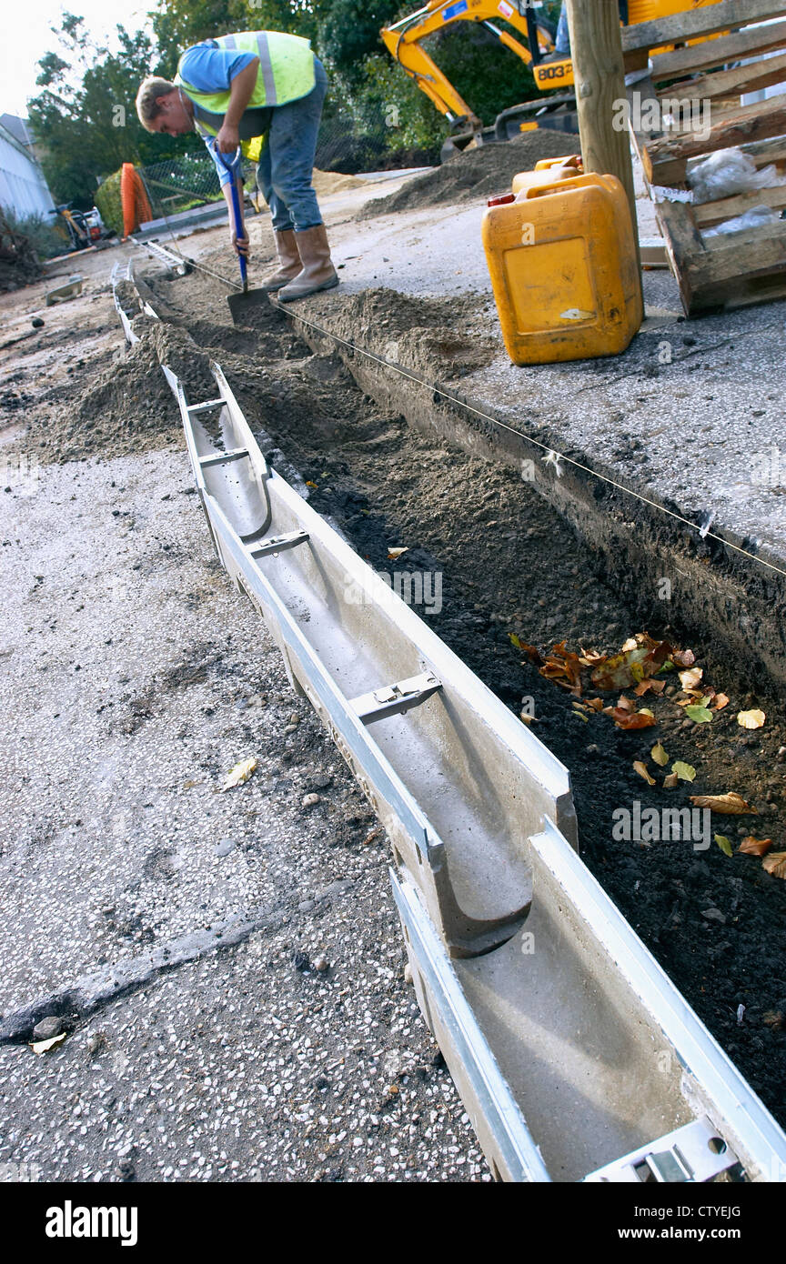 Footing drain pipes installed on pavement Stock Photo - Alamy