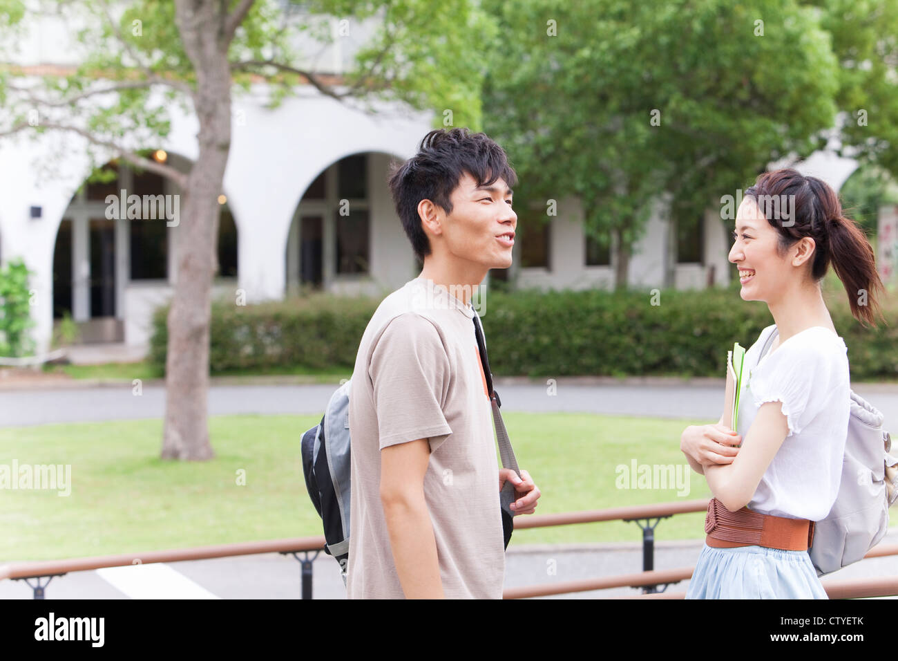 Two university students talking Stock Photo - Alamy