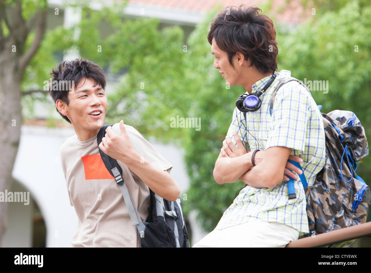 Two university students talking Stock Photo - Alamy