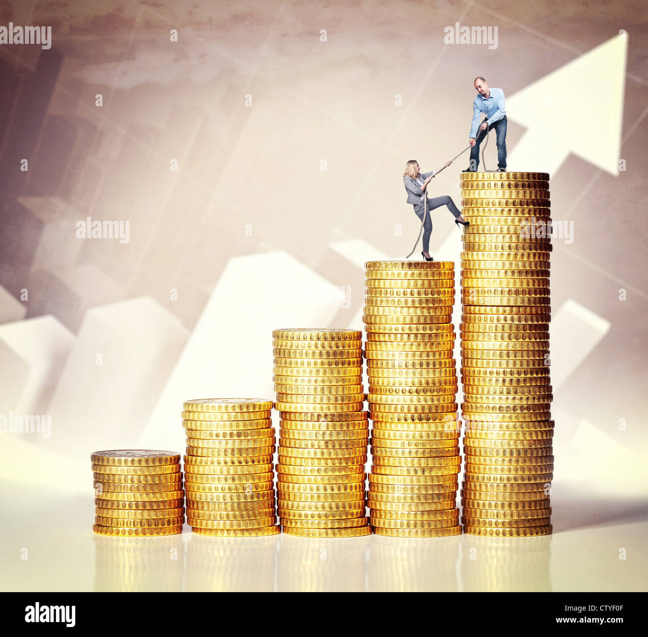 man help woman on coin piles Stock Photo - Alamy