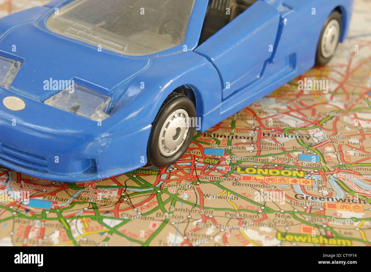 Blue model car on a route map of Greater London Stock Photo - Alamy