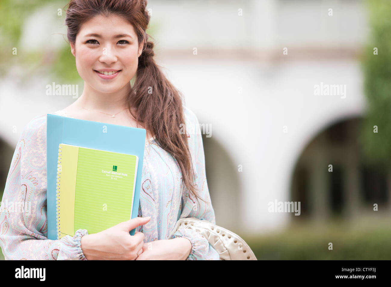 Young university student woman smiling Stock Photo - Alamy