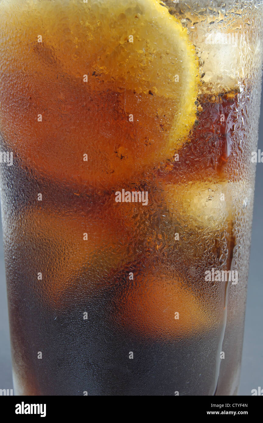 Condensation droplets on a glass of cola with ice and lemon Stock Photo ...