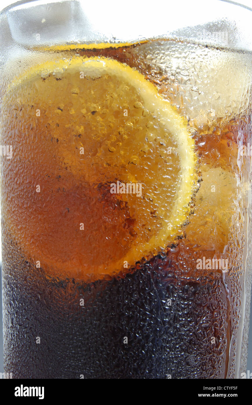 Condensation droplets on a glass of cola with ice and lemon Stock Photo ...