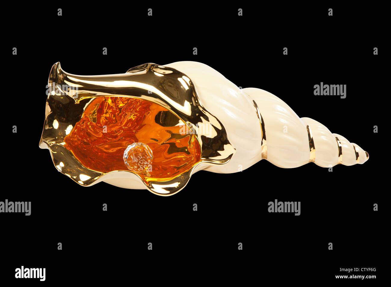 Artificial sea shell with pearl isolated on black background Stock ...