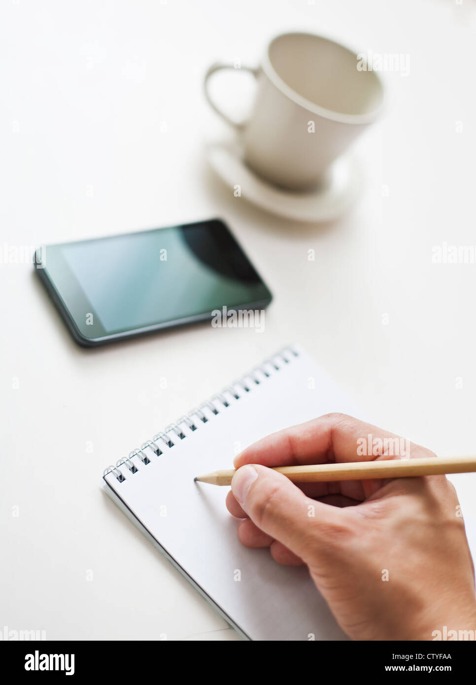 Writing notes or planning a schedule on blank spiral notebook Stock ...