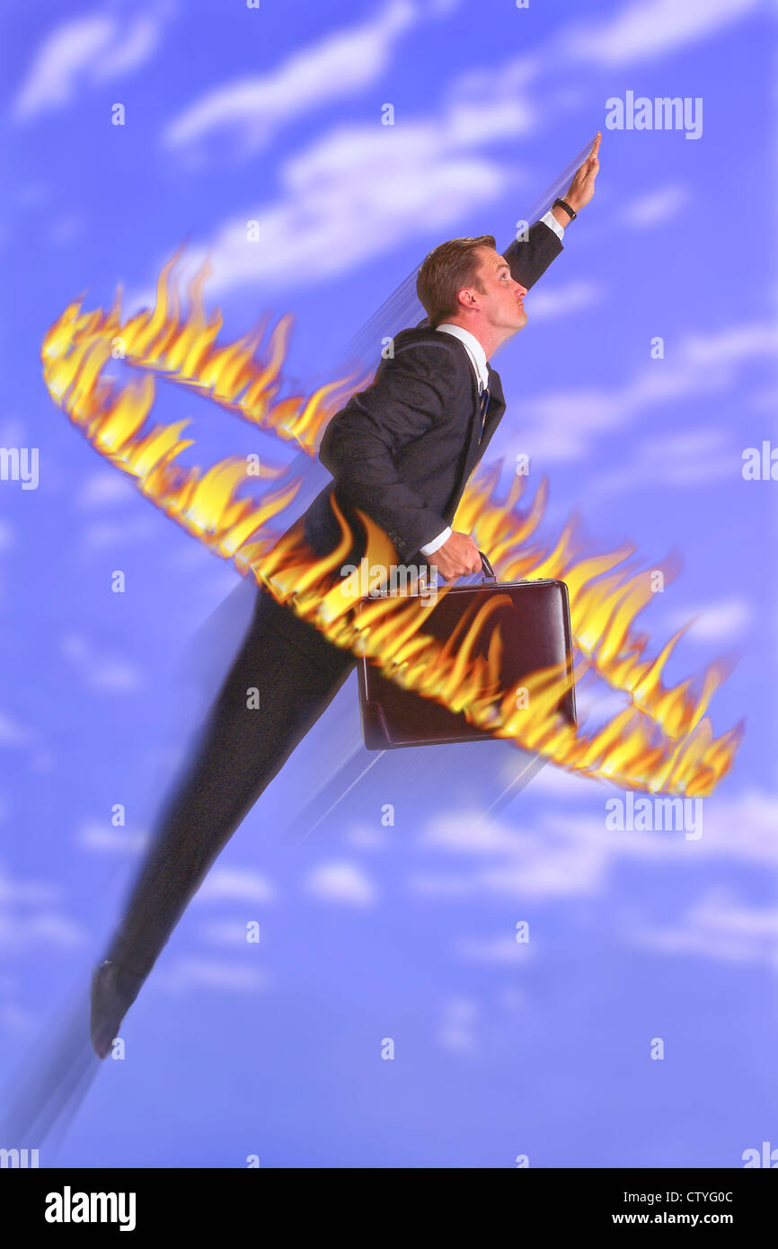 Man flying through ring of fire Stock Photo - Alamy