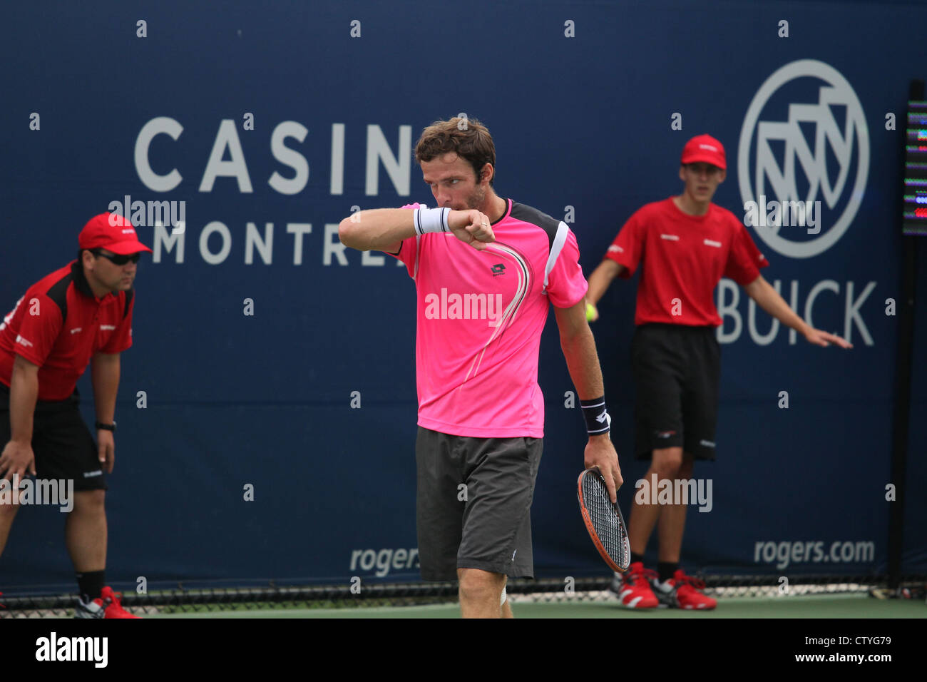 tennis player sweating hot heat Stock Photo - Alamy