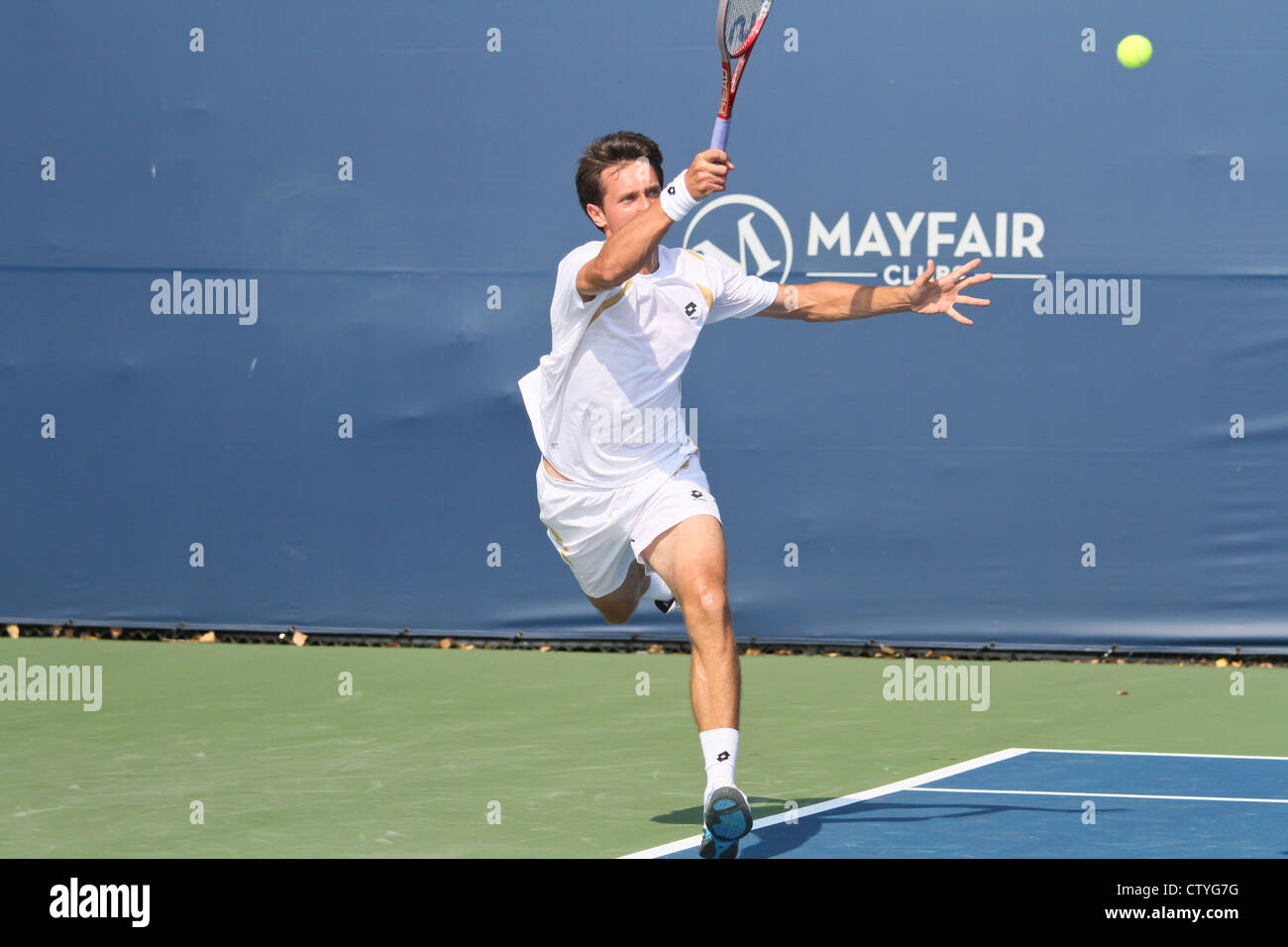 tennis action man playing Stock Photo - Alamy