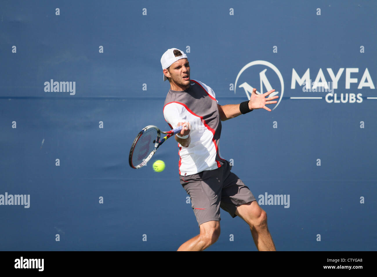 male tennis player action forehand return Stock Photo - Alamy