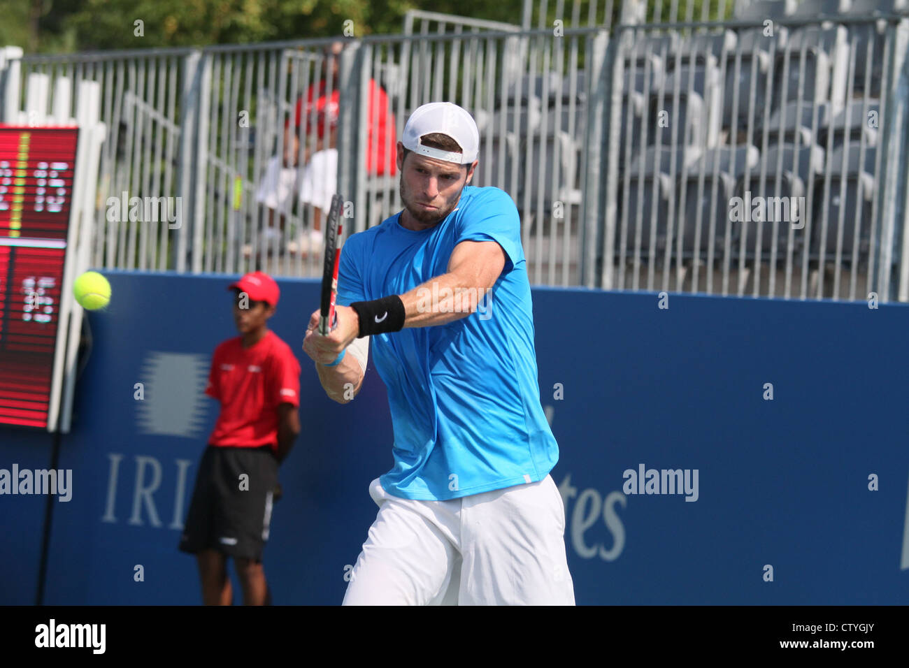 intense tennis player aiming ball backhand return Stock Photo - Alamy