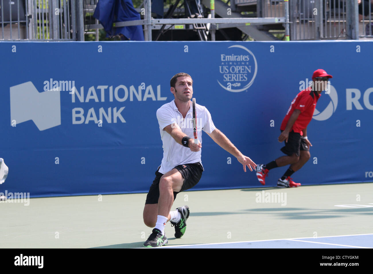man playing tennis forehand return ball boy Stock Photo - Alamy