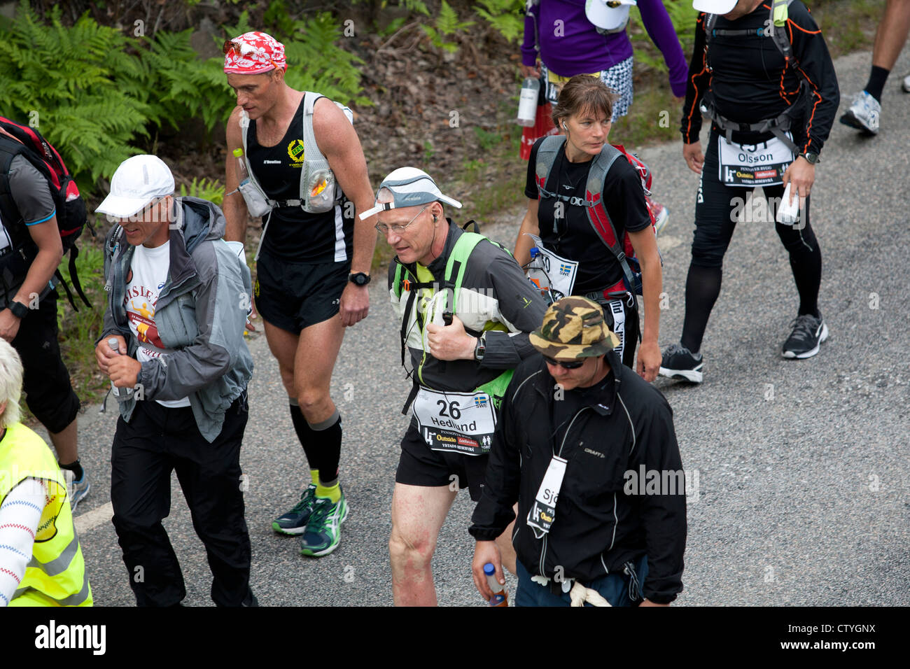 Walking racing on a highway with lots of people Stock Photo - Alamy
