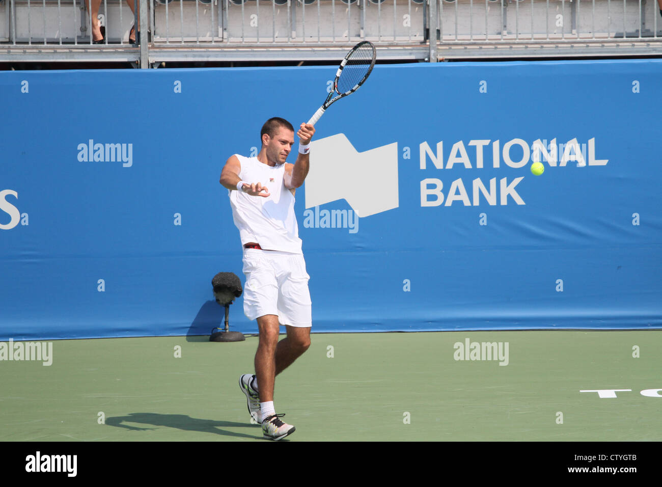 young male tennis player return serve forehead Stock Photo - Alamy