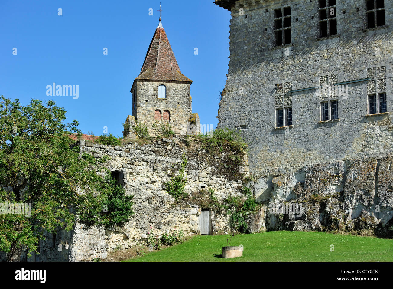Church tower and the medieval castle Château de Lavardens in the Midi ...