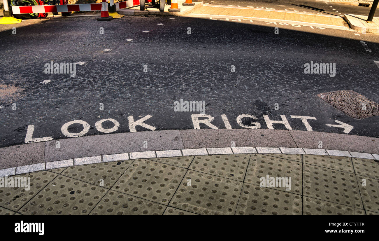 "Look Right", sign on road edge advising safety for pedestrians Stock ...
