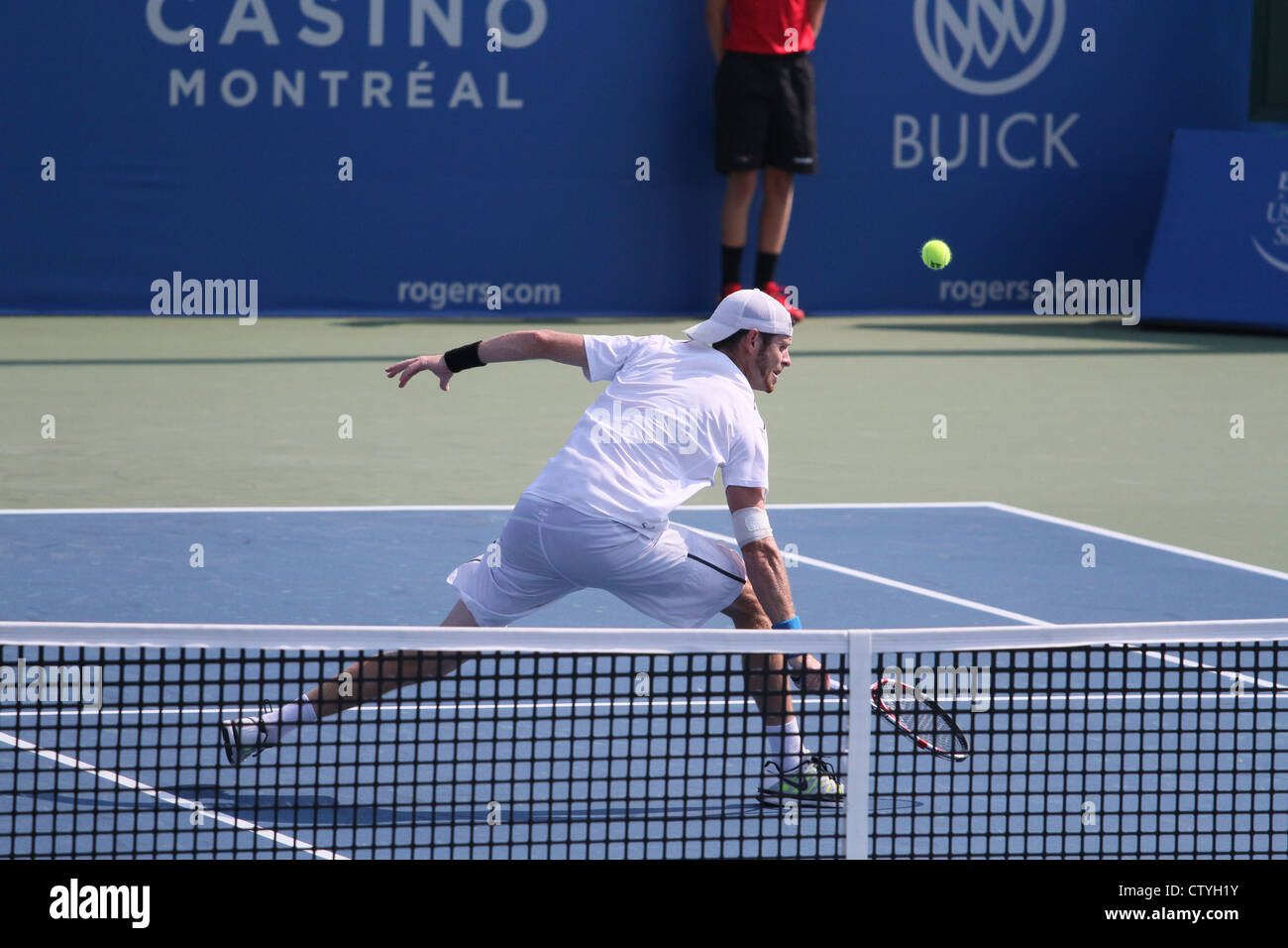 tennis action net ball man playing backhand Stock Photo - Alamy