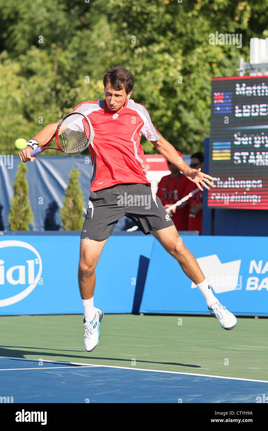 man playing tennis backhand return Stock Photo - Alamy