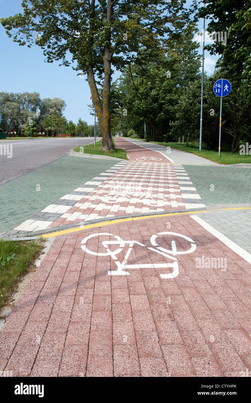 paved bicycle path crosses the street Stock Photo - Alamy