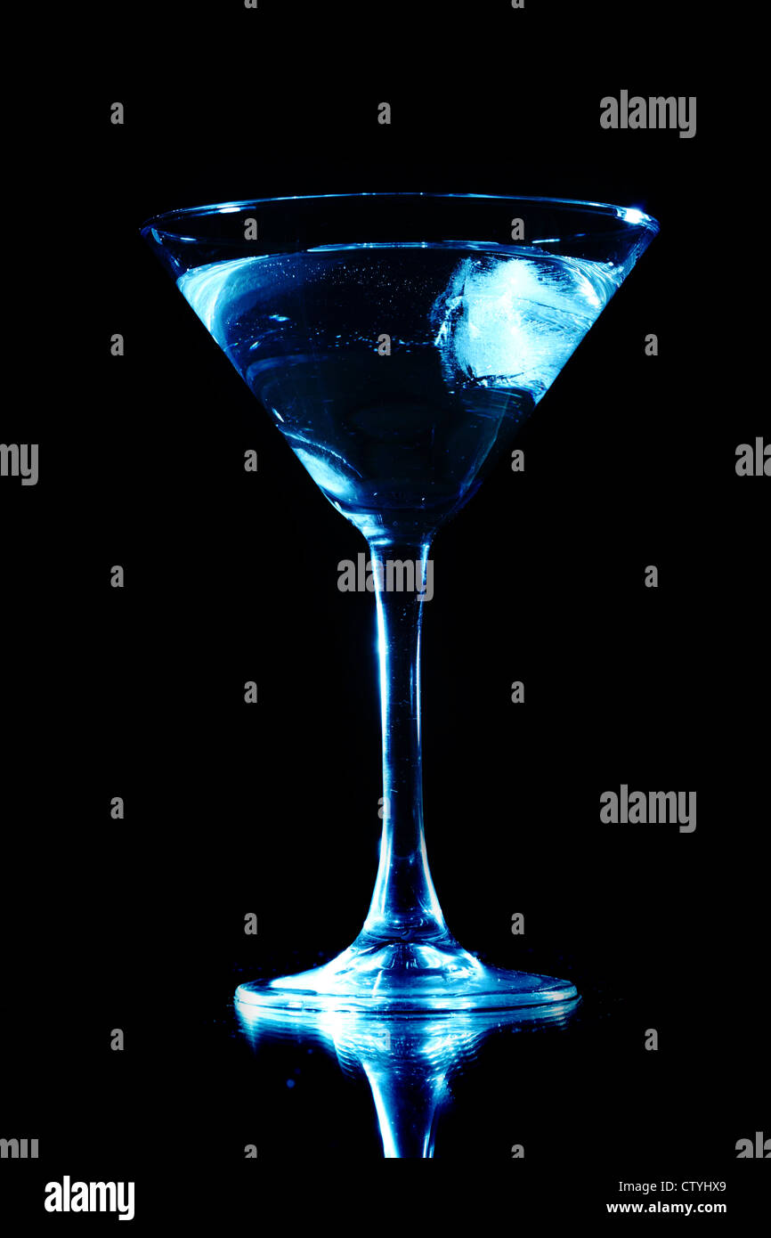 martini glass with alcohol and ice Stock Photo - Alamy