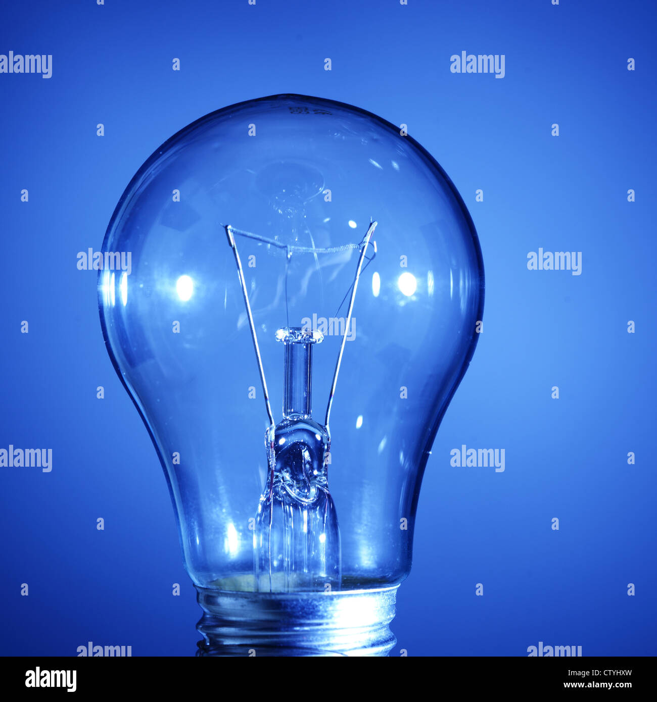 light bulb on blue background Stock Photo - Alamy