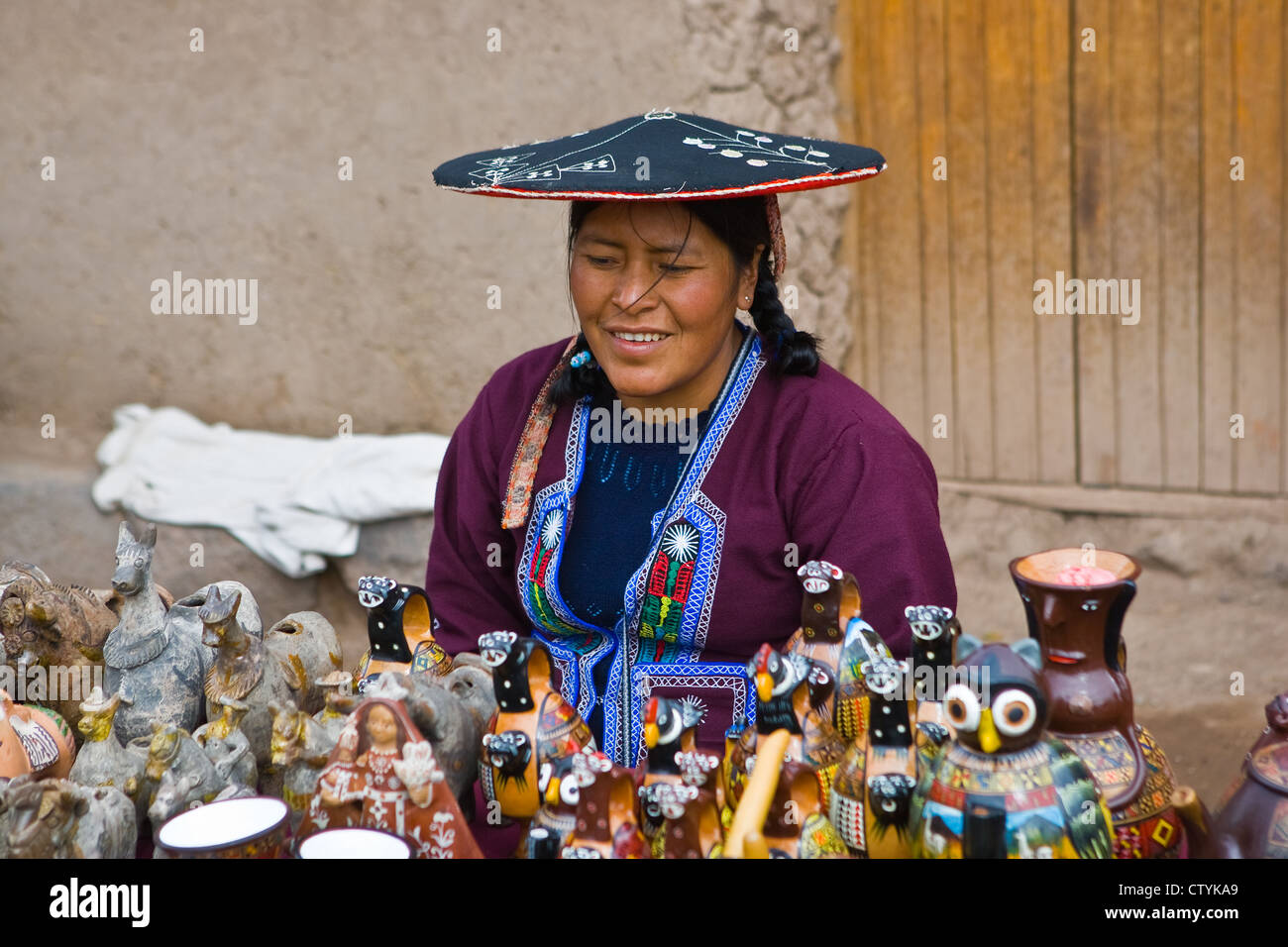 Woman selling souvenirs on a local market Stock Photo - Alamy