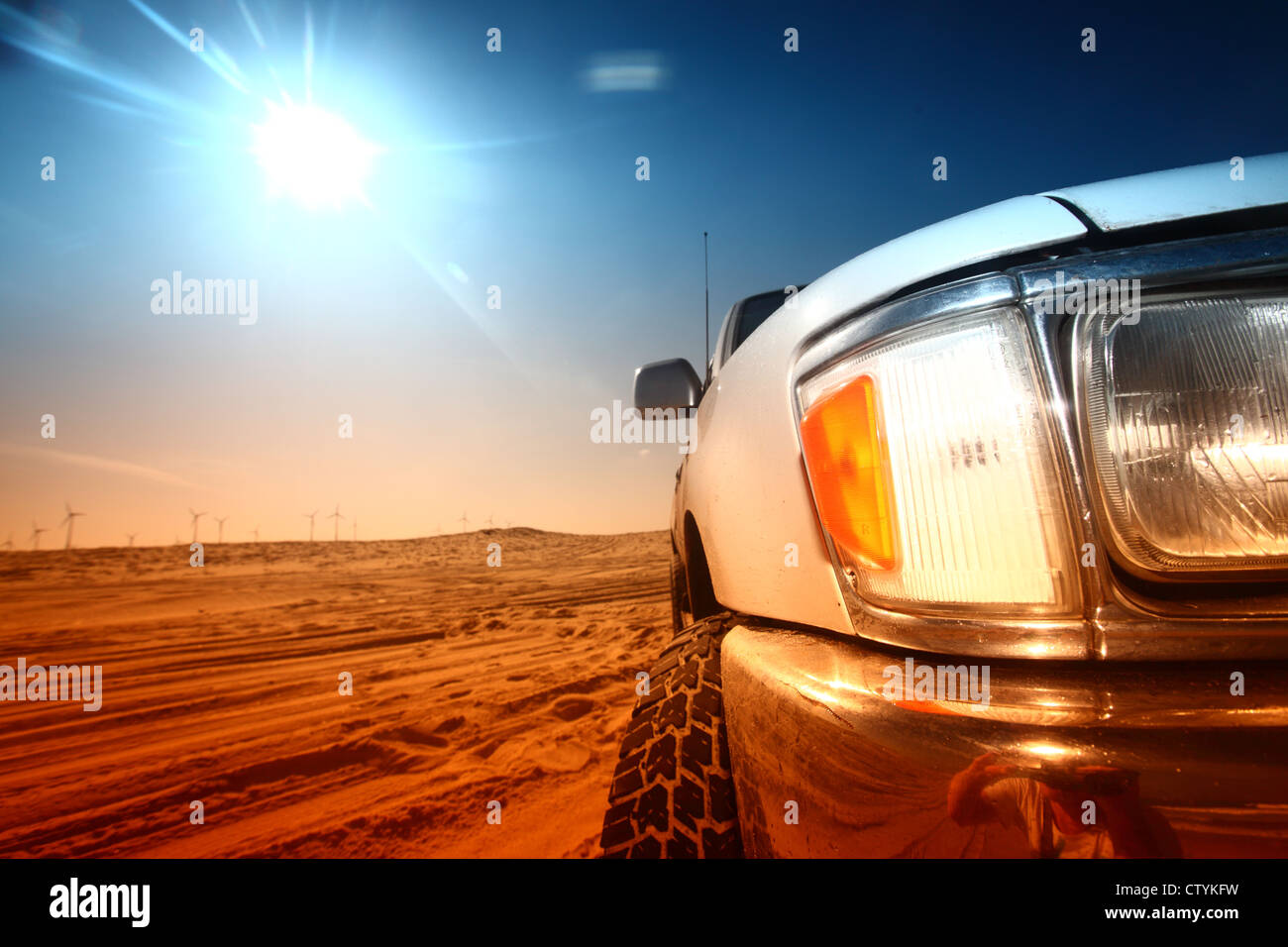 truck in desert sand and blue sky Stock Photo - Alamy