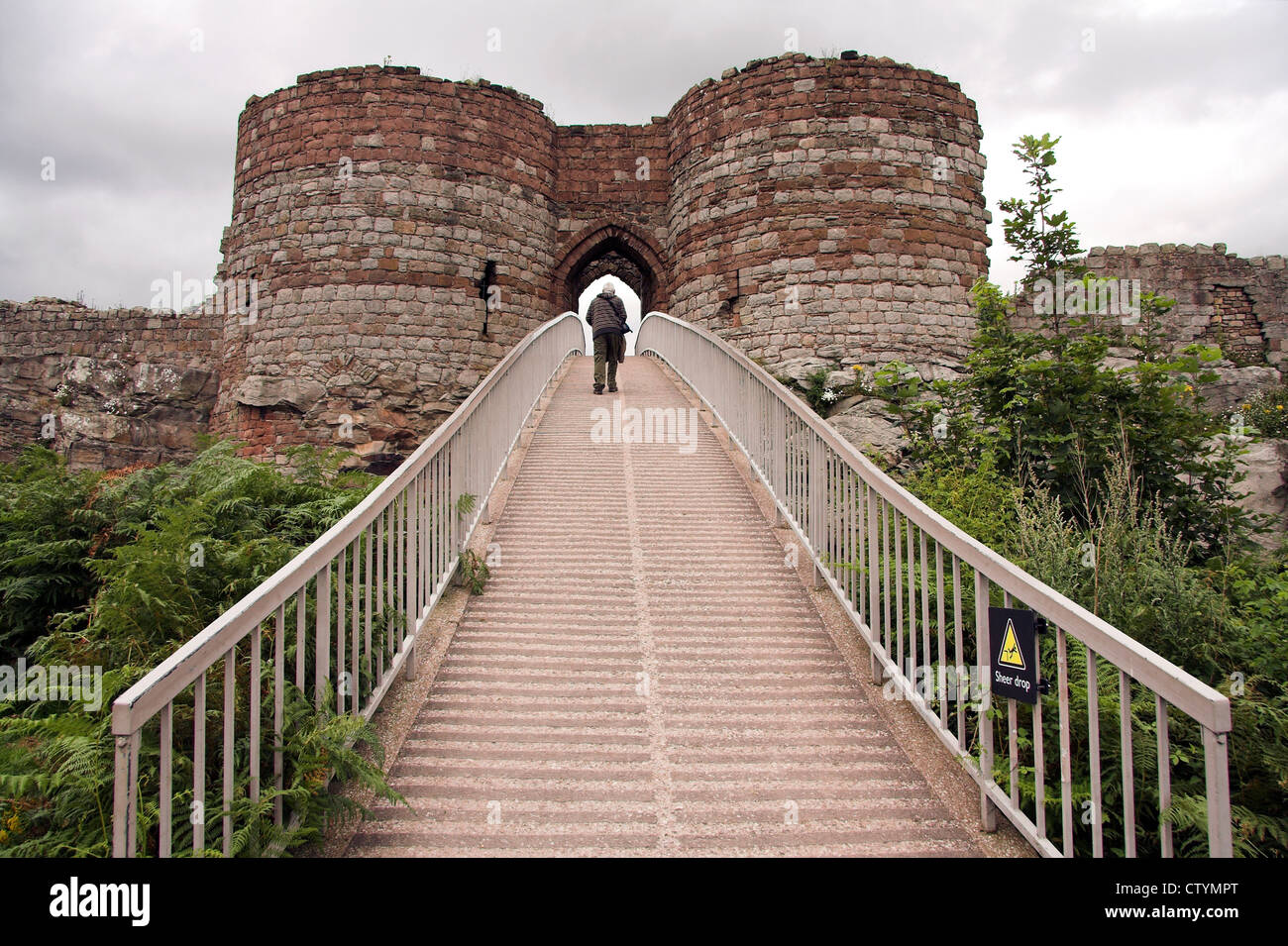 Castle ruins, man walking over the bridge to the Inner Ward, Beeston ...