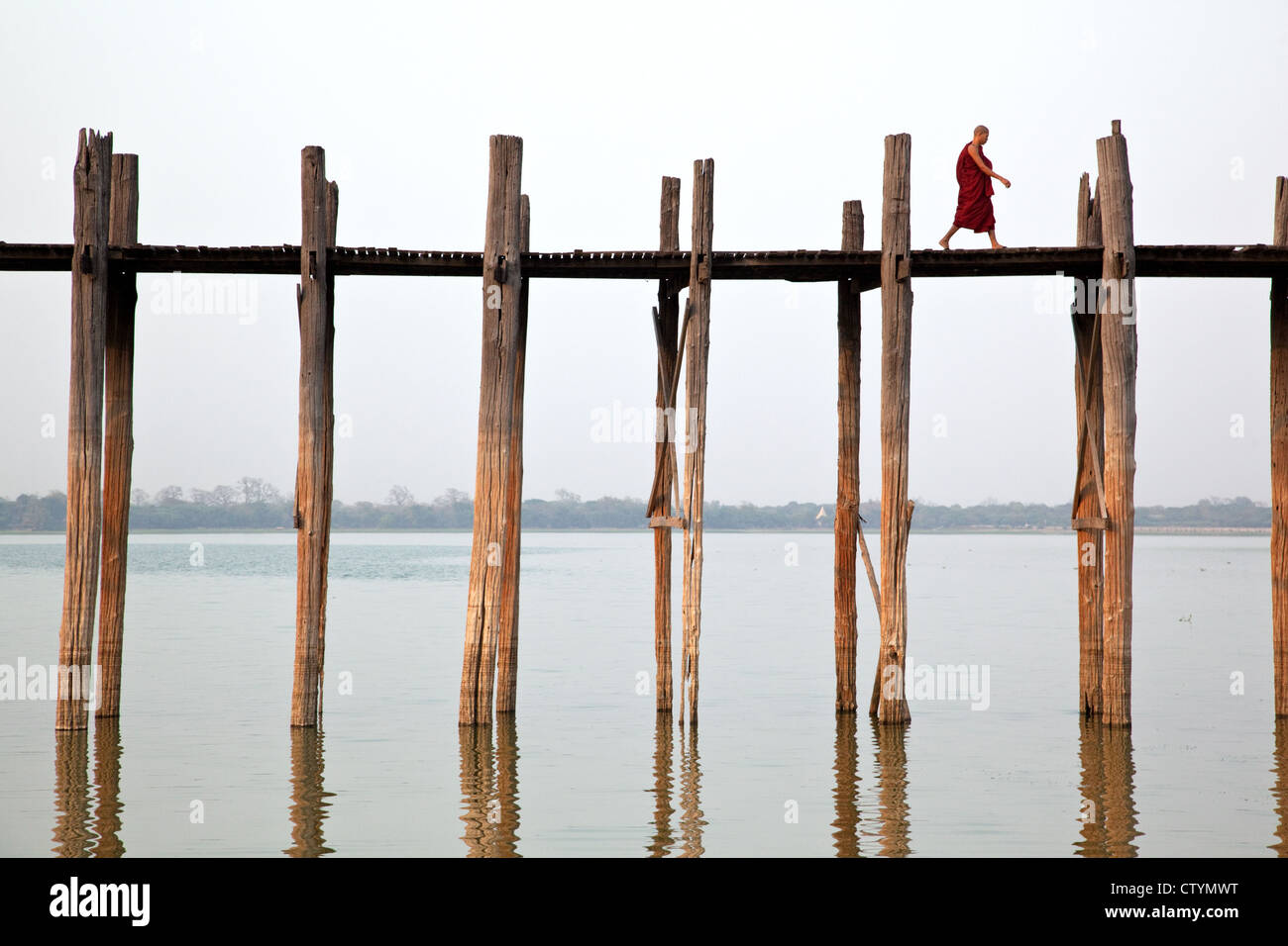 Monk crossing U Bein Bridge - the longest teak bridge (footbridge) in ...