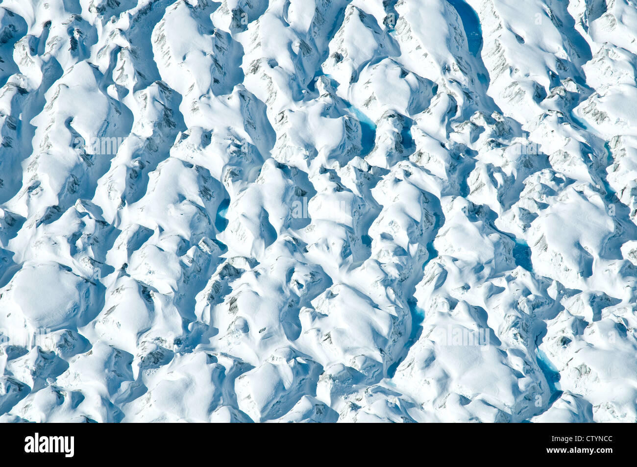 An aerial view of the surface details of a glacier in the icefields of ...