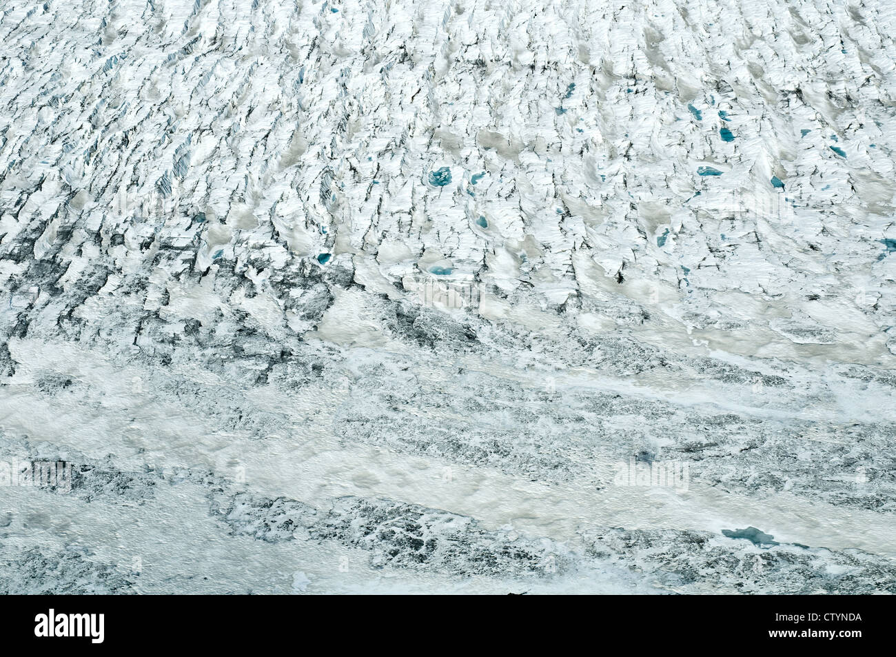 An aerial view of the surface details of a glacier in the icefields of ...
