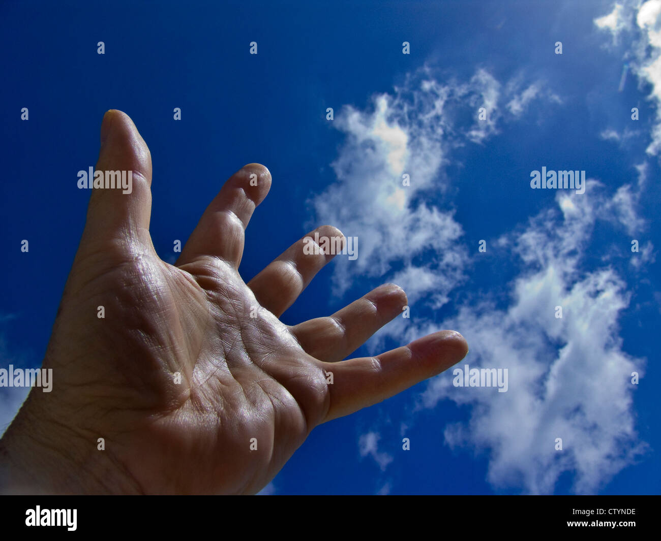 Male hand stretches imploringly up to the sky Stock Photo - Alamy
