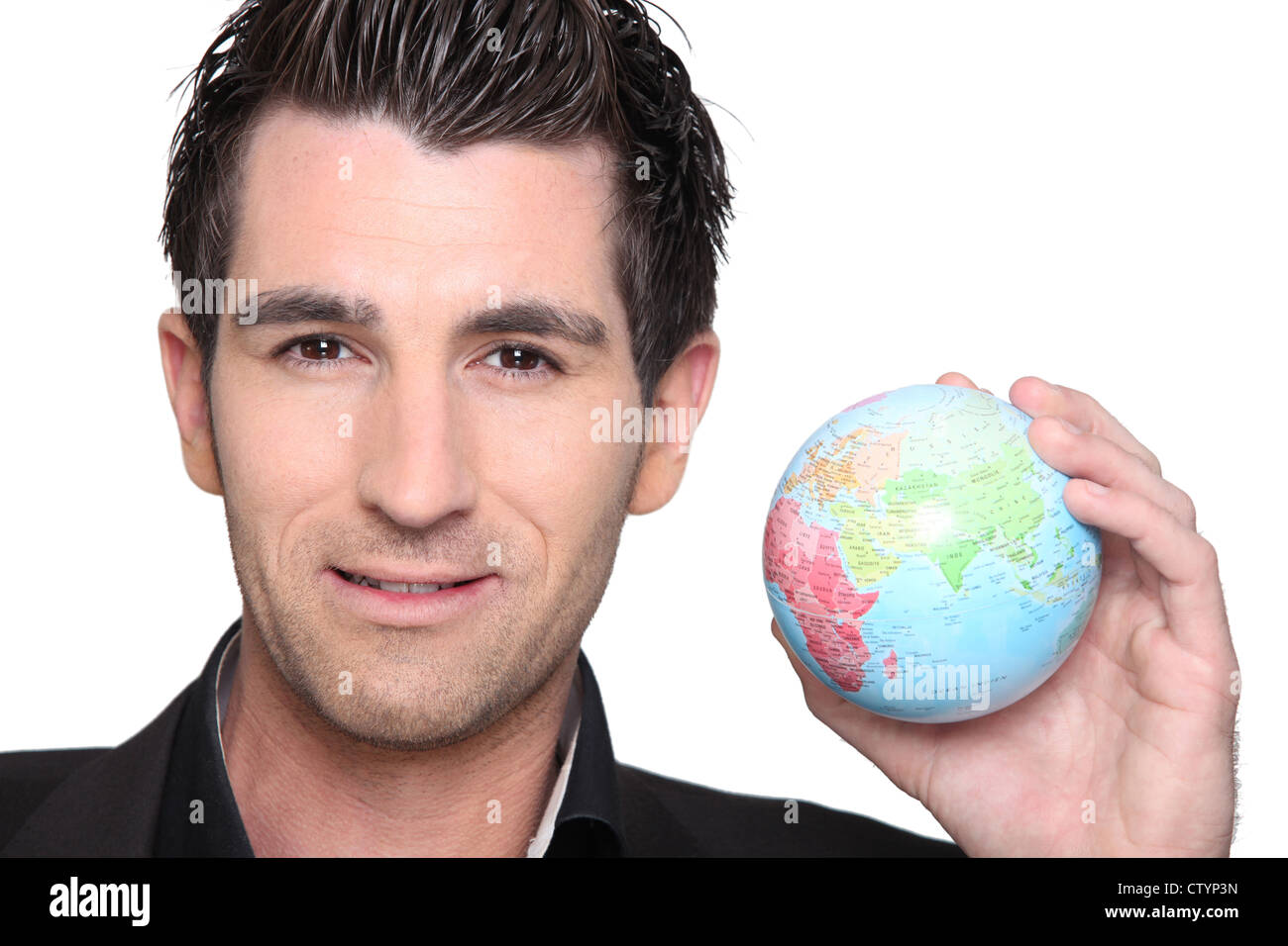 Man with globe in hand Stock Photo - Alamy