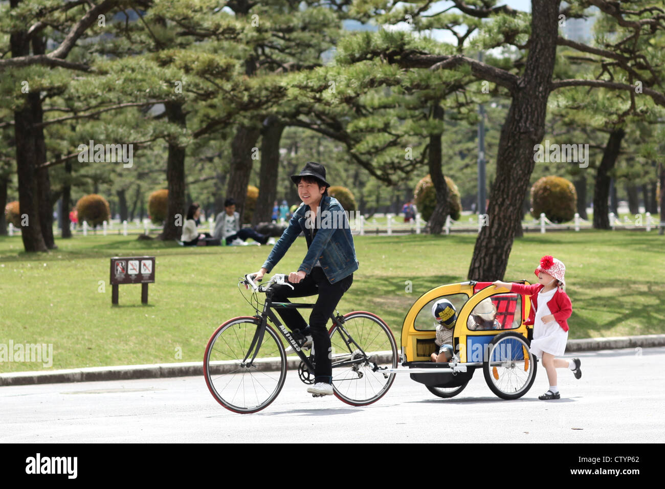 Father and children on a bicycle, in Tokyo, Japan Stock Photo - Alamy