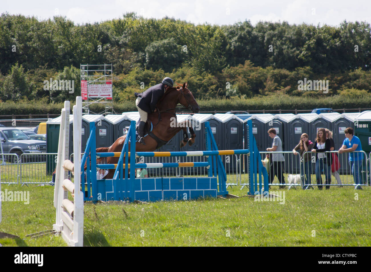 Show jumping balancing on horse Stock Photo - Alamy
