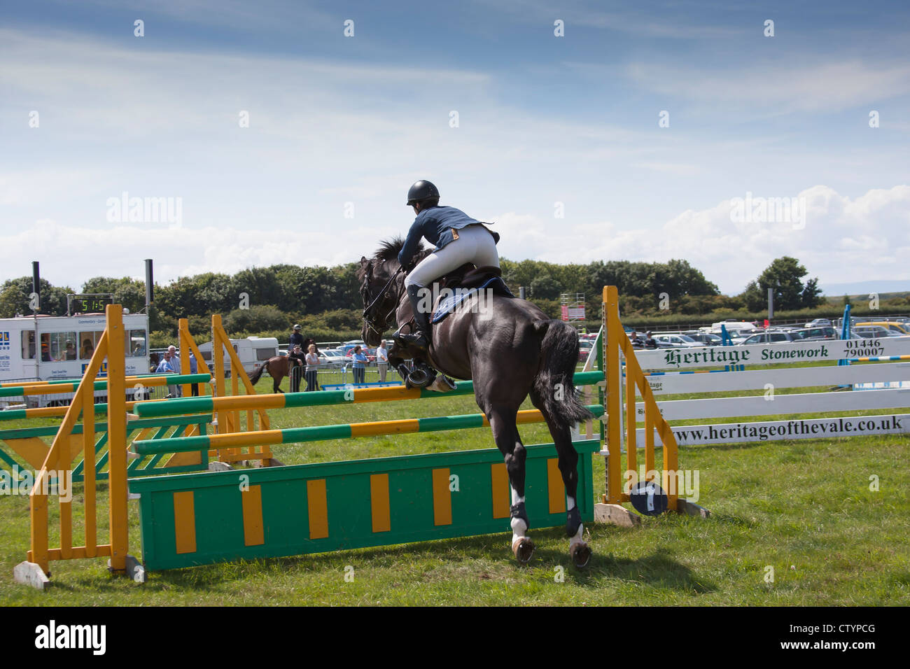 Show jumping lady rider rear view Stock Photo - Alamy