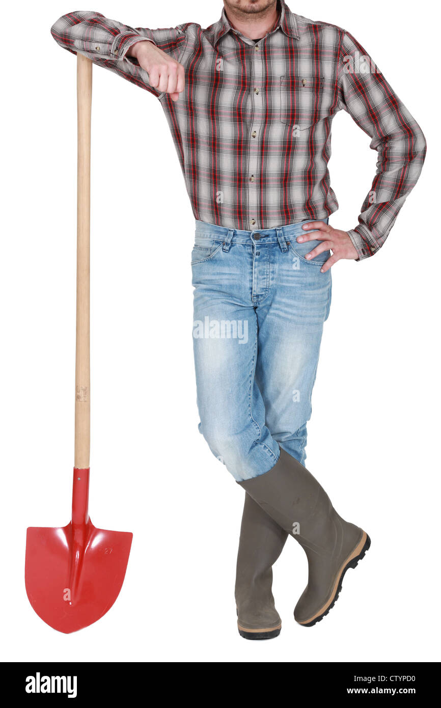 Man leaning on shovel hi-res stock photography and images - Alamy