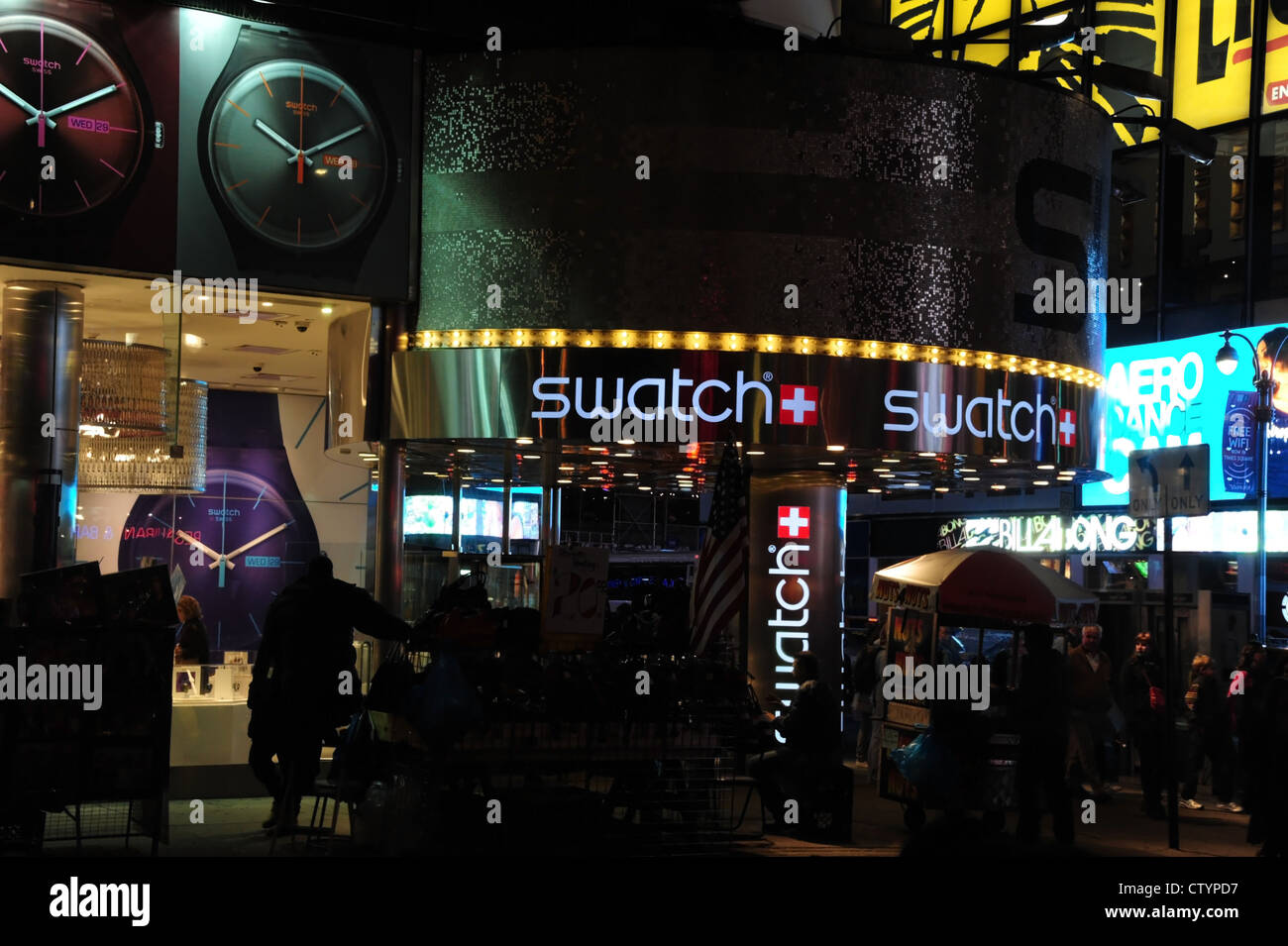 Night neon view people, dark silhouettes sidewalk stalls, Swatch Store ...