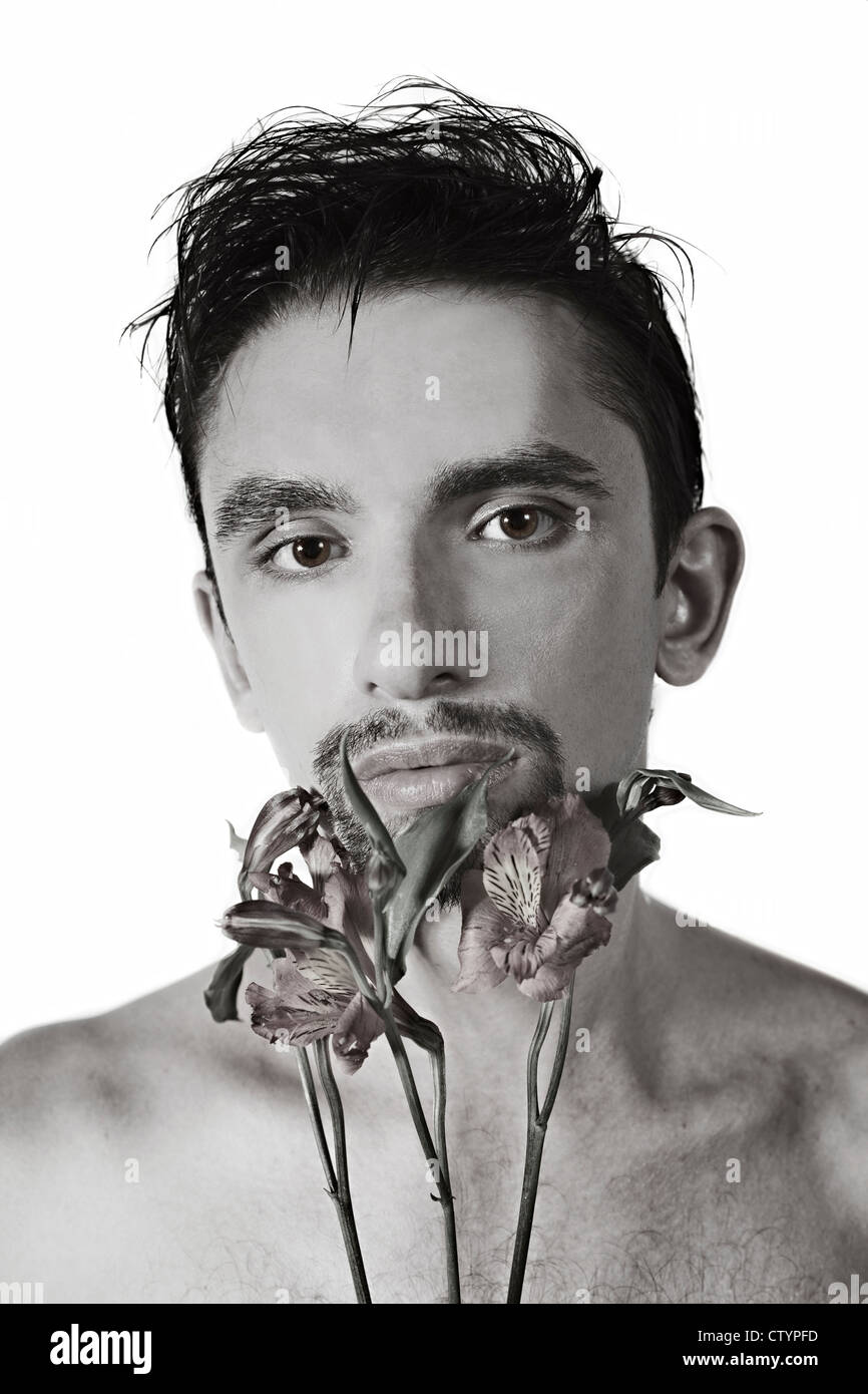 Face of young man with flower close up Stock Photo - Alamy
