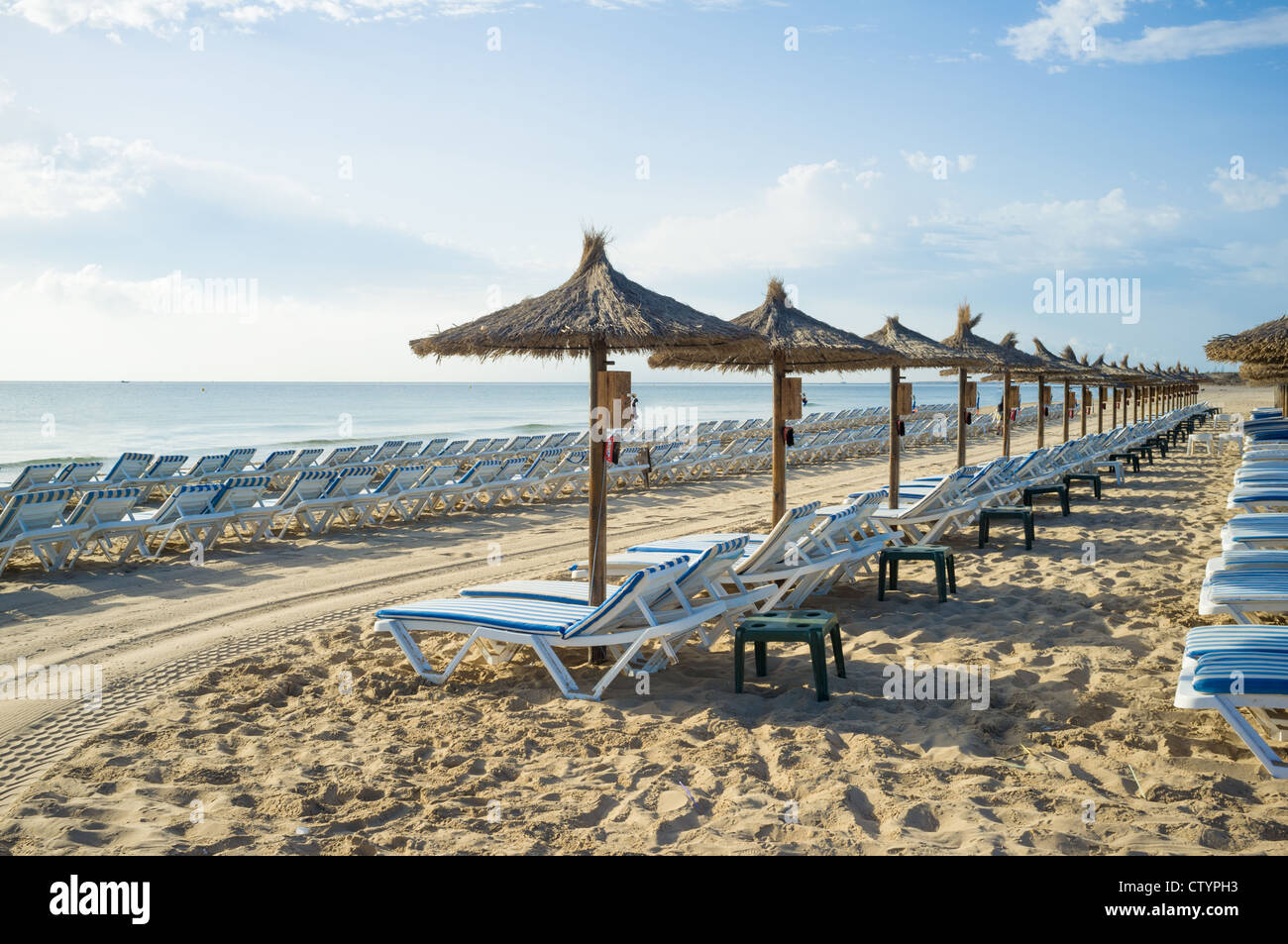 Early morning on a sunny Mediterranean resort beach Stock Photo - Alamy