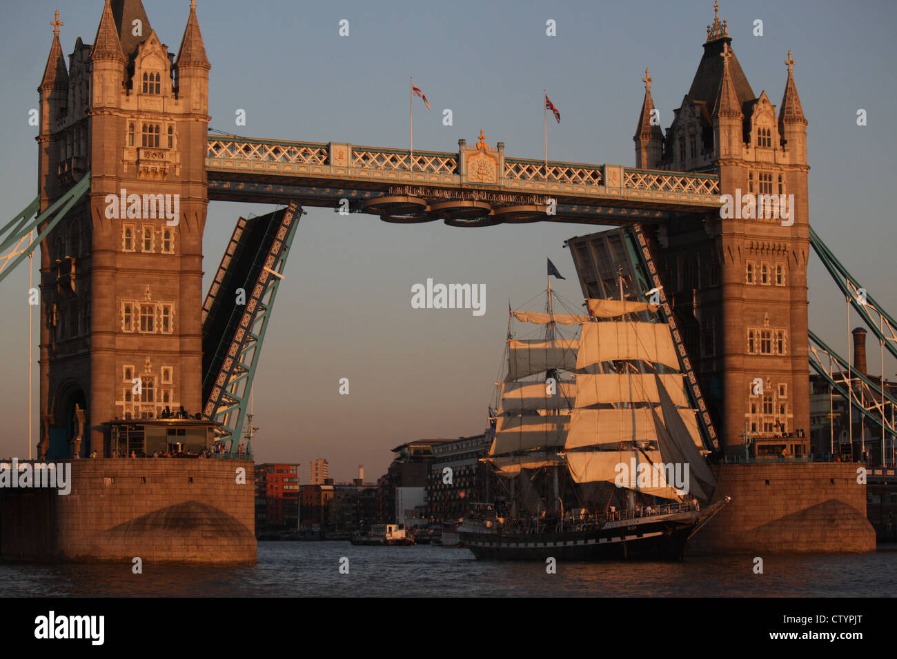 Tall ship going under Tower Bridge in evening sunshine Stock Photo - Alamy