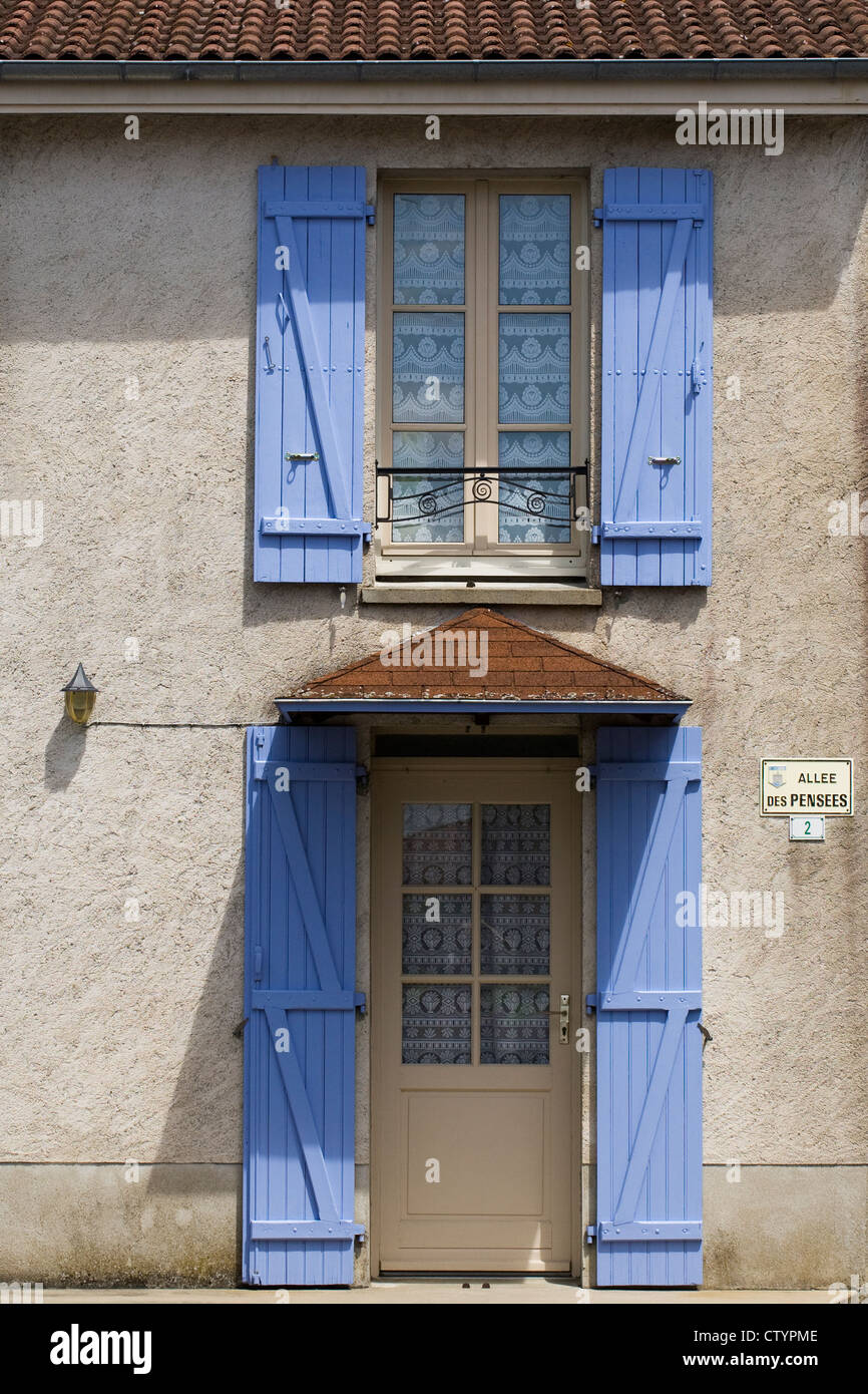 Blue shutters on a French window and door Stock Photo - Alamy