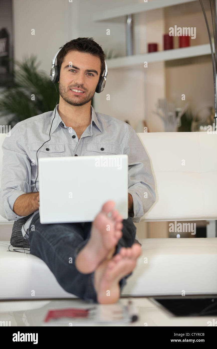 Man using headphones Stock Photo - Alamy