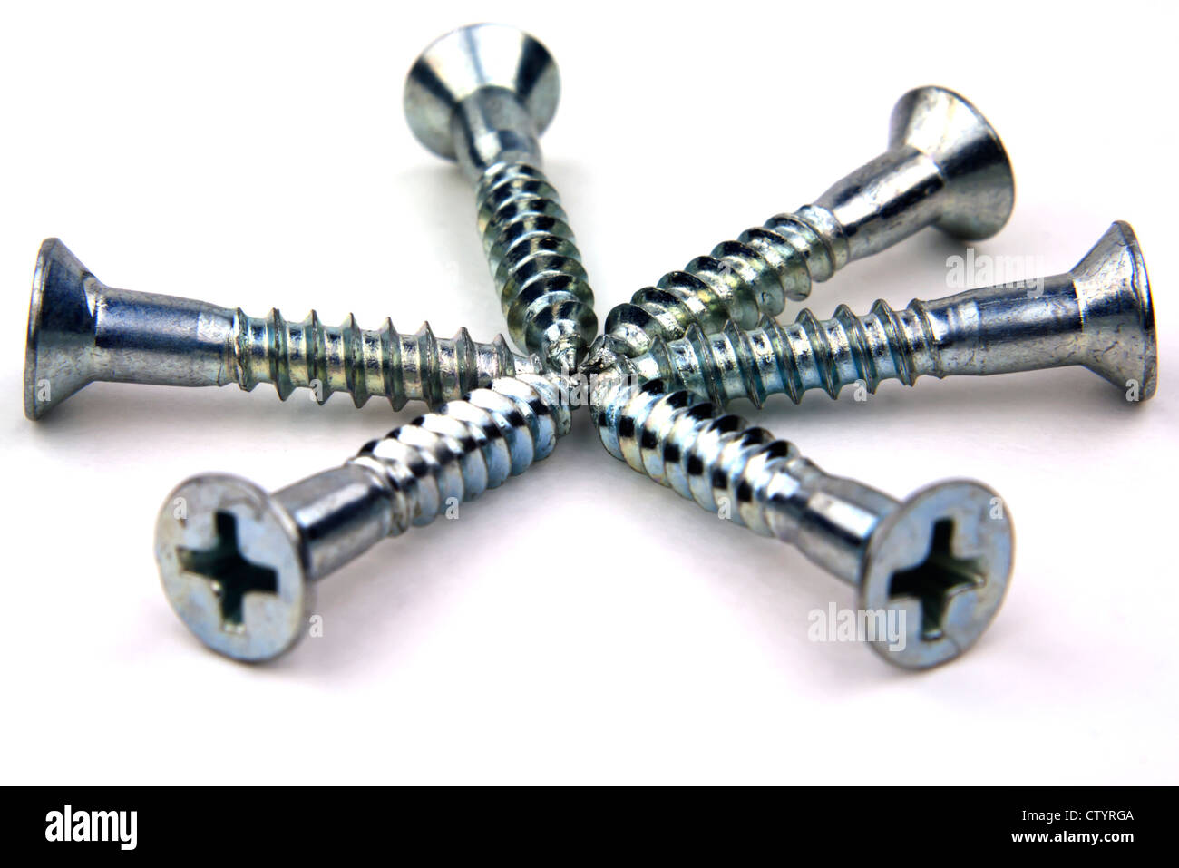 Close up macro of silver hardware screws isolated on white background ...