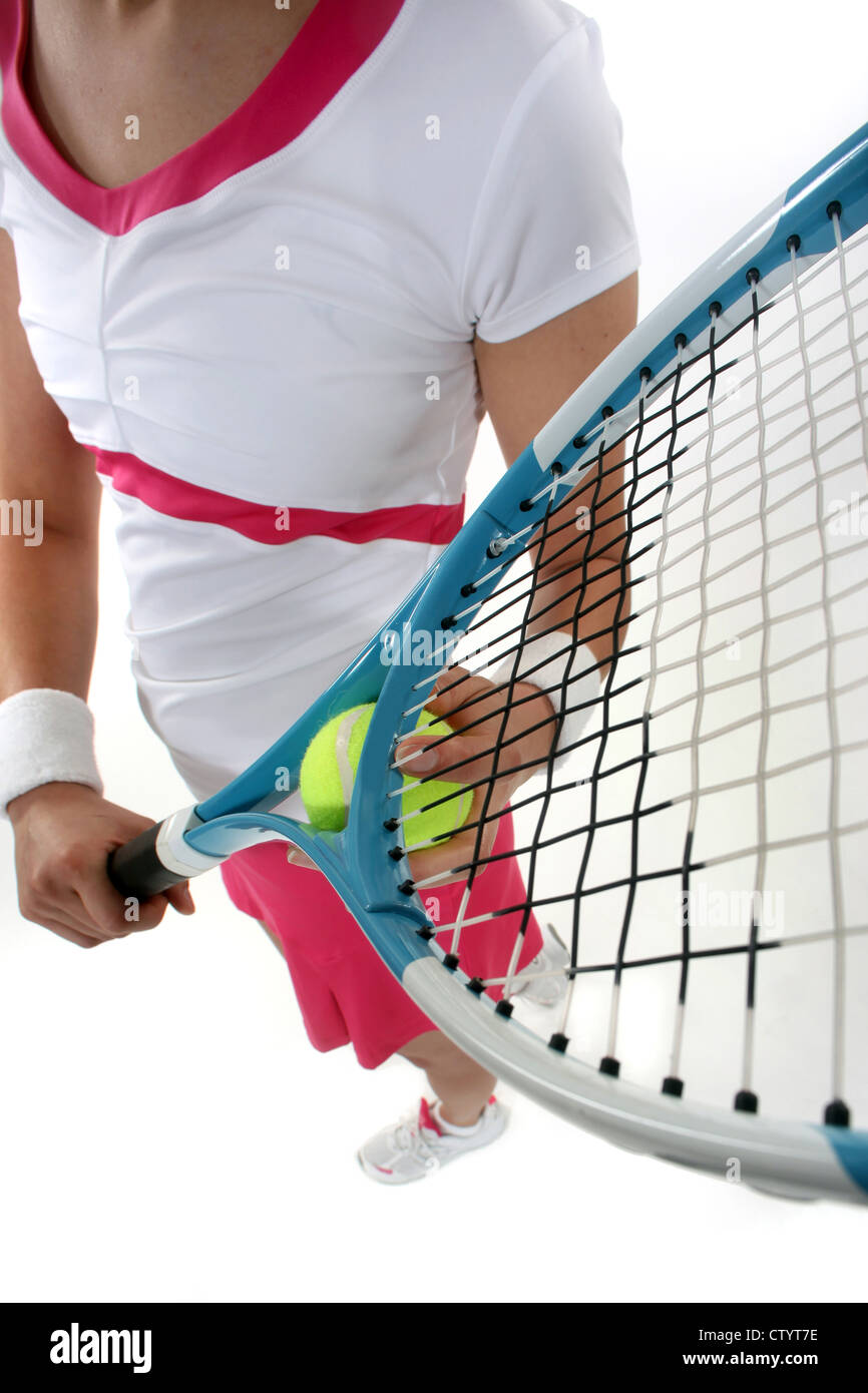 Close-up of woman holding tennis racquet Stock Photo - Alamy