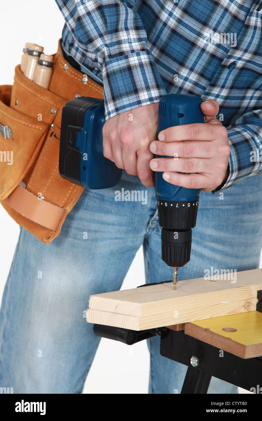 man using an electrical screwdriver Stock Photo - Alamy