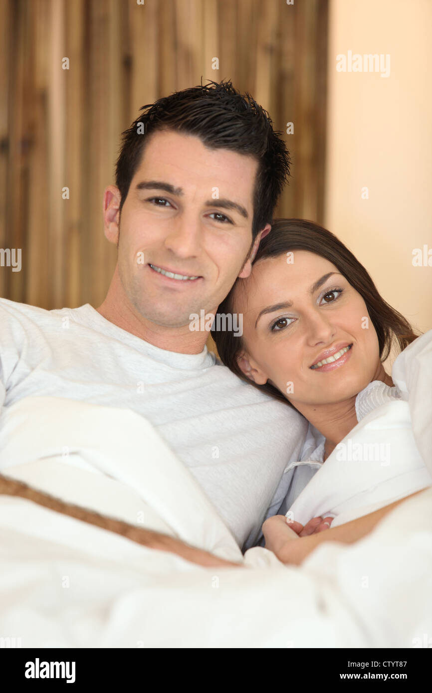 Young couple in bed Stock Photo - Alamy