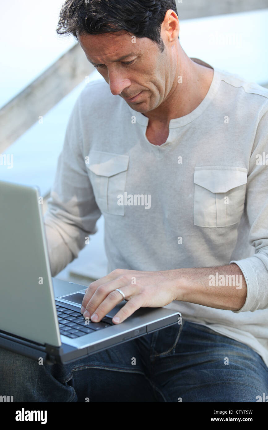 Man with computer Stock Photo - Alamy