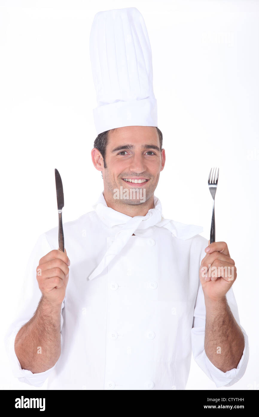 Chef holding fork knife hi-res stock photography and images - Alamy