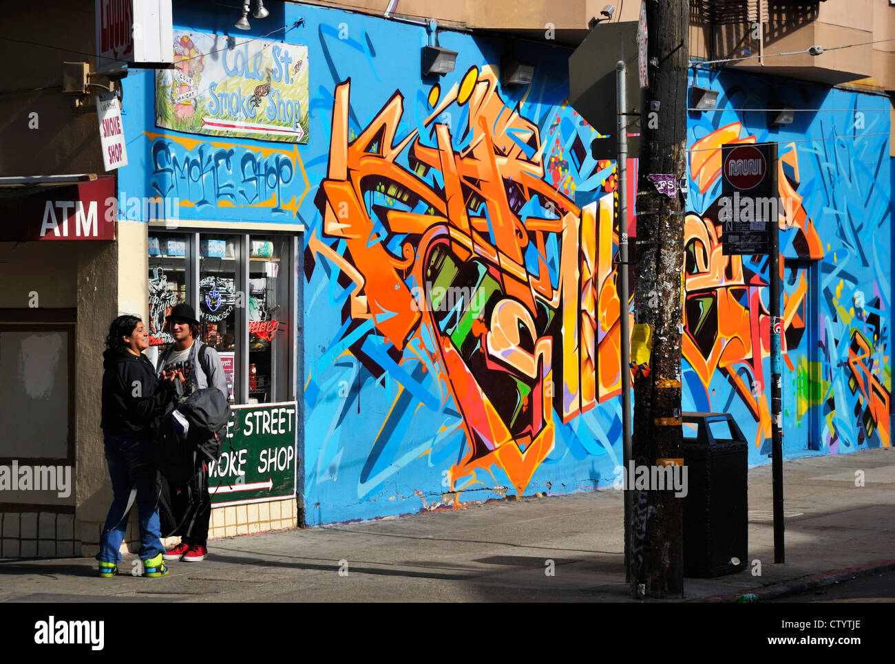 Men standing in front of graffiti wall hi-res stock photography and ...